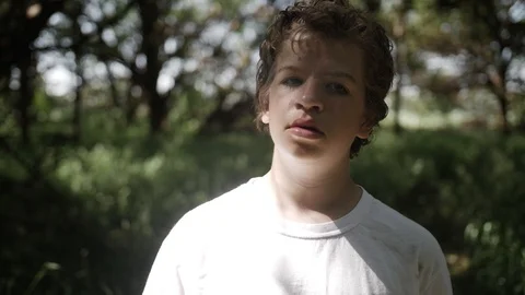 Creepy teen boy walks in slow motion in ... | Stock Video | Pond5