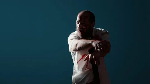 Creepy zombie growling at camera while s... | Stock Video | Pond5