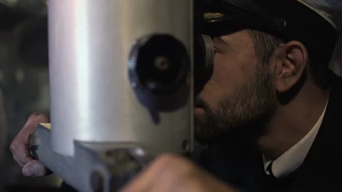 Crewman looking through periscope of sub... | Stock Video | Pond5