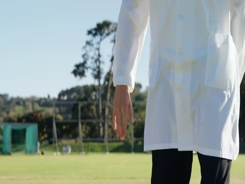 Cricket umpire signaling a leg bye durin... | Stock Video | Pond5