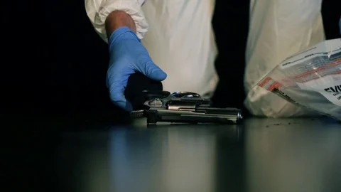 Crime scene forensic detective, revolver... | Stock Video | Pond5