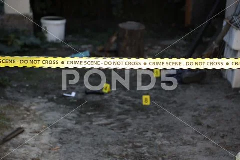 Crime scene tape for covering the area cordon. Yellow tape with blurred ...