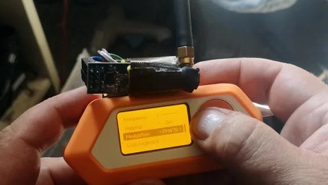 Criminal hacker using Flipper Zero in di... | Stock Video | Pond5