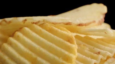 Crinkle cut crisps potato chips against ... | Stock Video | Pond5