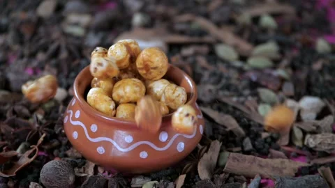 Crispy lotus pop seeds falling inside an... | Stock Video | Pond5