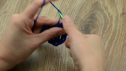 crocheting a half double crochet of wool... | Stock Video | Pond5