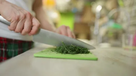 Crop man chopping herbs on cutting board... | Stock Video | Pond5