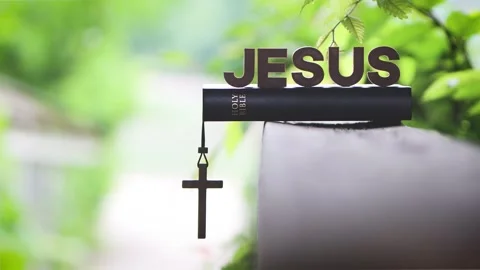 The cross of Jesus Christ, the Bible, bi... | Stock Video | Pond5