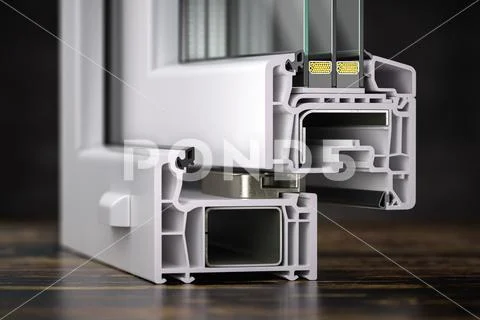 Cross section of plastic window profile PVC slose up on the table ...