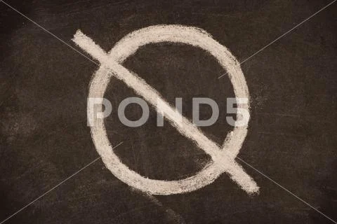 A crossed-out circle drawn on the board with chalk. Prohibition concept ...