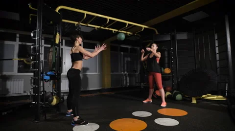 Crossfit ball fitness workout two woman | Stock Video | Pond5