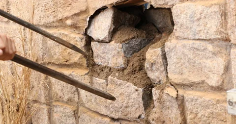 Crowbar Breaking The Stone Wall | Stock Video | Pond5