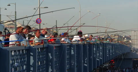 Crowd of fishermen with rods fish on Gal... | Stock Video | Pond5