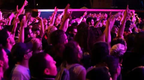 Crowd jumping at rock concert (pan) | Stock Video | Pond5