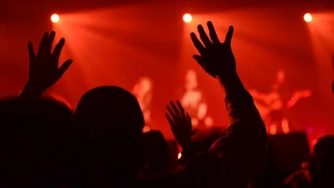 Crowd lifting hands during worship | Stock Video | Pond5