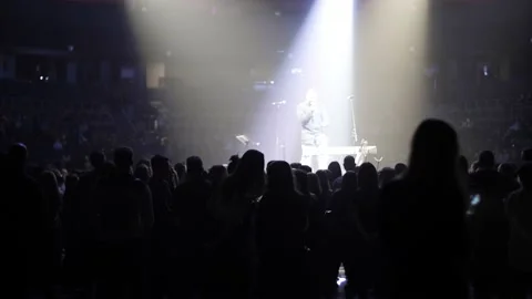Crowd of people around the stage. Man on... | Stock Video | Pond5