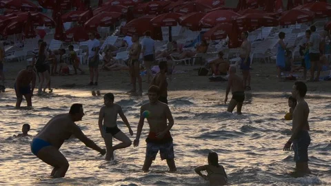 Crowd of people in a crowded beach swimm... | Stock Video | Pond5