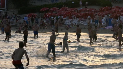 Crowd of people in a crowded beach swimm... | Stock Video | Pond5