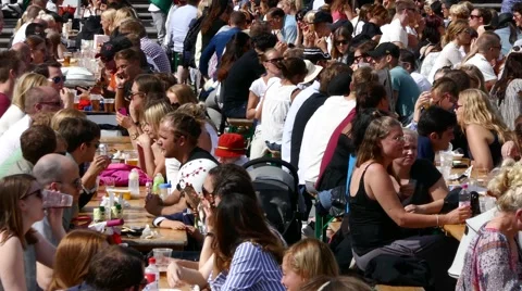 Crowd of people eating food drinking bee... | Stock Video | Pond5