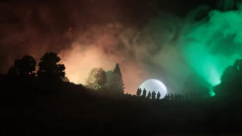 Crowd of people in forest at night watch... | Stock Video | Pond5