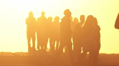 Crowd of people in the light of bright y... | Stock Video | Pond5