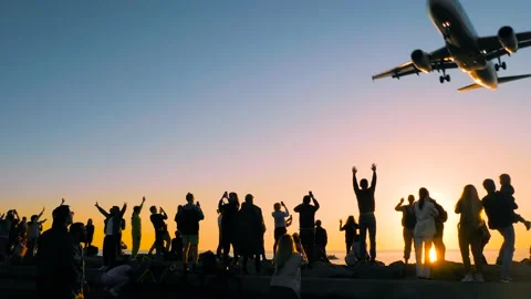 Crowd of people meets the arriving airpl... | Stock Video | Pond5