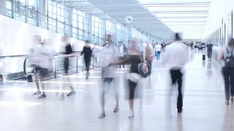 Crowd of people move through passage on ... | Stock Video | Pond5