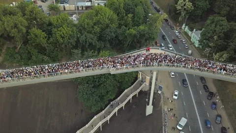 A crowd of people on a pedestrian bridge... | Stock Video | Pond5