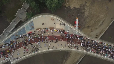 A crowd of people on a pedestrian bridge... | Stock Video | Pond5