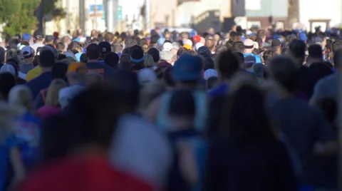 A crowd of people running in a 10K race. | Stock Video | Pond5
