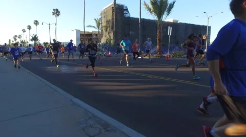 A crowd of people running in a 10K race. | Stock Video | Pond5
