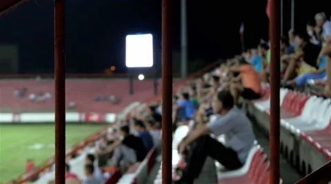 Crowd of people sitting on stadium stand... | Stock Video | Pond5