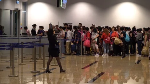 A crowd of people standing in line. Pass... | Stock Video | Pond5