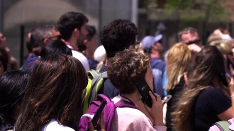 Crowd of people talking by the phones, p... | Stock Video | Pond5