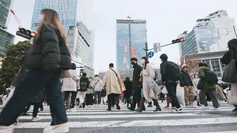 Crowd people walk cross road at Shibuya ... | Stock Video | Pond5