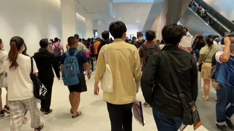 Crowd of people walking inside Queen Sir... | Stock Video | Pond5