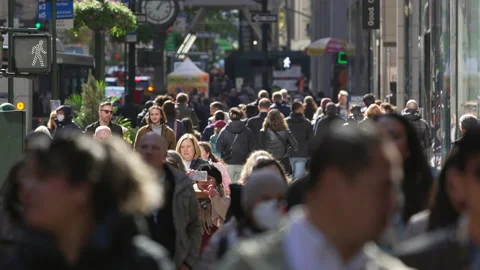 Crowd of people walking street backlit s... | Stock Video | Pond5