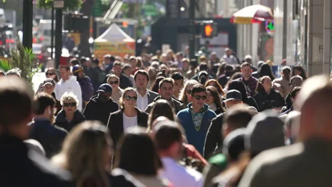 Crowd of people walking street backlit s... | Stock Video | Pond5