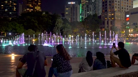 Crowd of people watching famous light wa... | Stock Video | Pond5