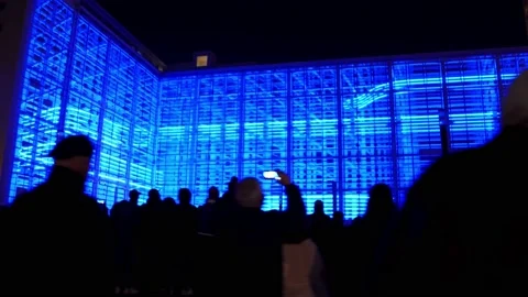 crowd of people watching GLOW light show... | Stock Video | Pond5
