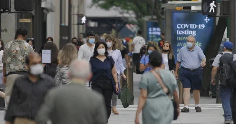 Crowd of people wearing mask masks walki... | Stock Video | Pond5