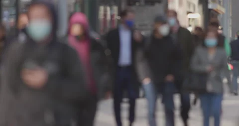 Crowd of people wearing mask masks walki... | Stock Video | Pond5
