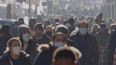 Crowd of people wearing mask masks walki... | Stock Video | Pond5