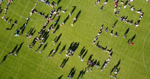 A Crowd Spelling Out Letters Using Their... | Stock Video | Pond5