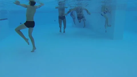 Crowd in swimming pool captured by under... | Stock Video | Pond5