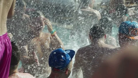 Crowd of teenagers splashing water Pool ... | Stock Video | Pond5