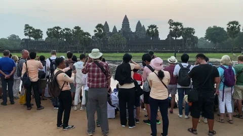 Crowd of tourists visit the Angkor Wat t... | Stock Video | Pond5