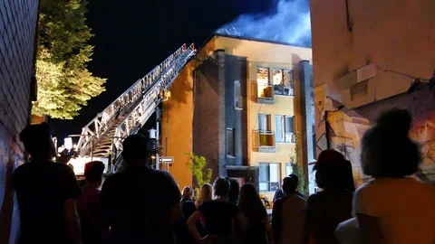 Crowd watching condo building fire | Stock Video | Pond5