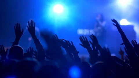 Crowd waving their hands and and enjoyin... | Stock Video | Pond5