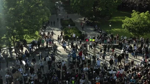 crowded park with protest signs in NYC W... | Stock Video | Pond5